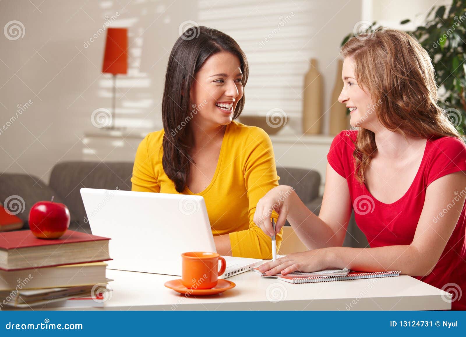 Schoolgirls Laughing at Table Stock Image - Image of homework, good ...