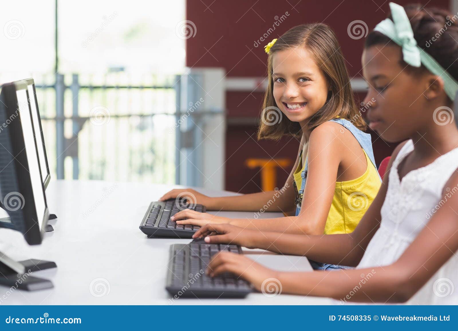 Schoolgirls Using Computer in Classroom Stock Image - Image of ...