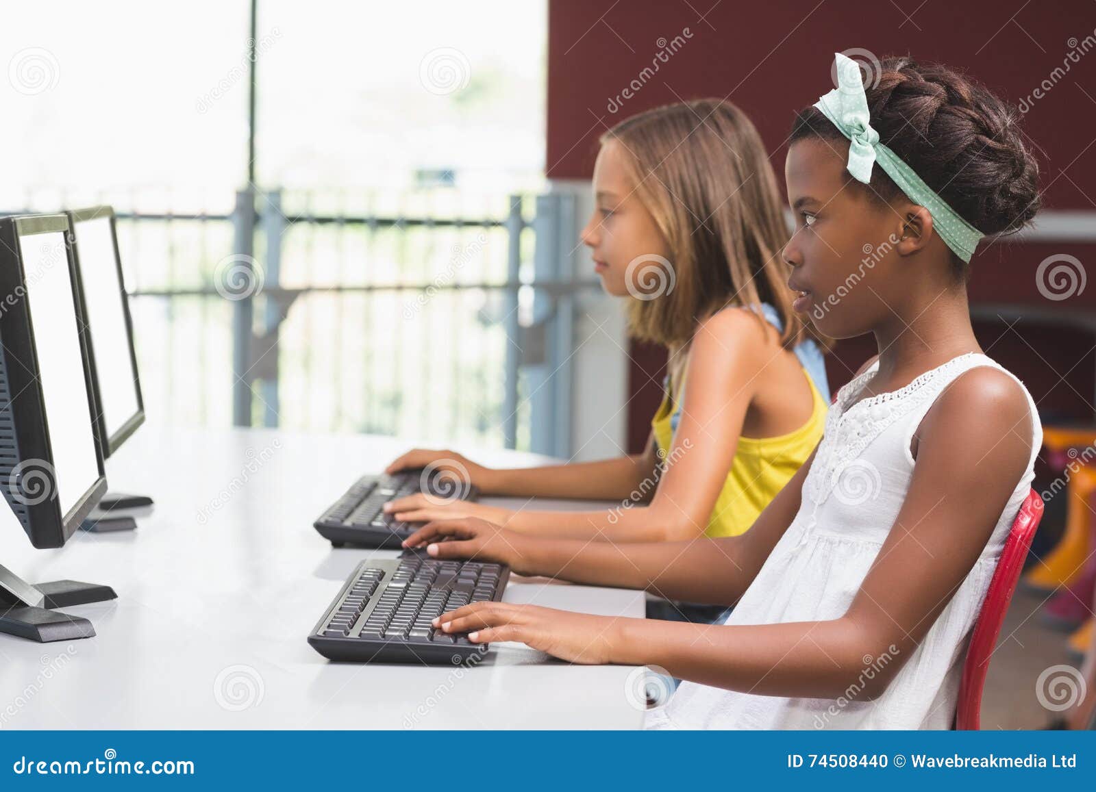 Schoolgirls Using Computer in Classroom Stock Photo - Image of girl ...