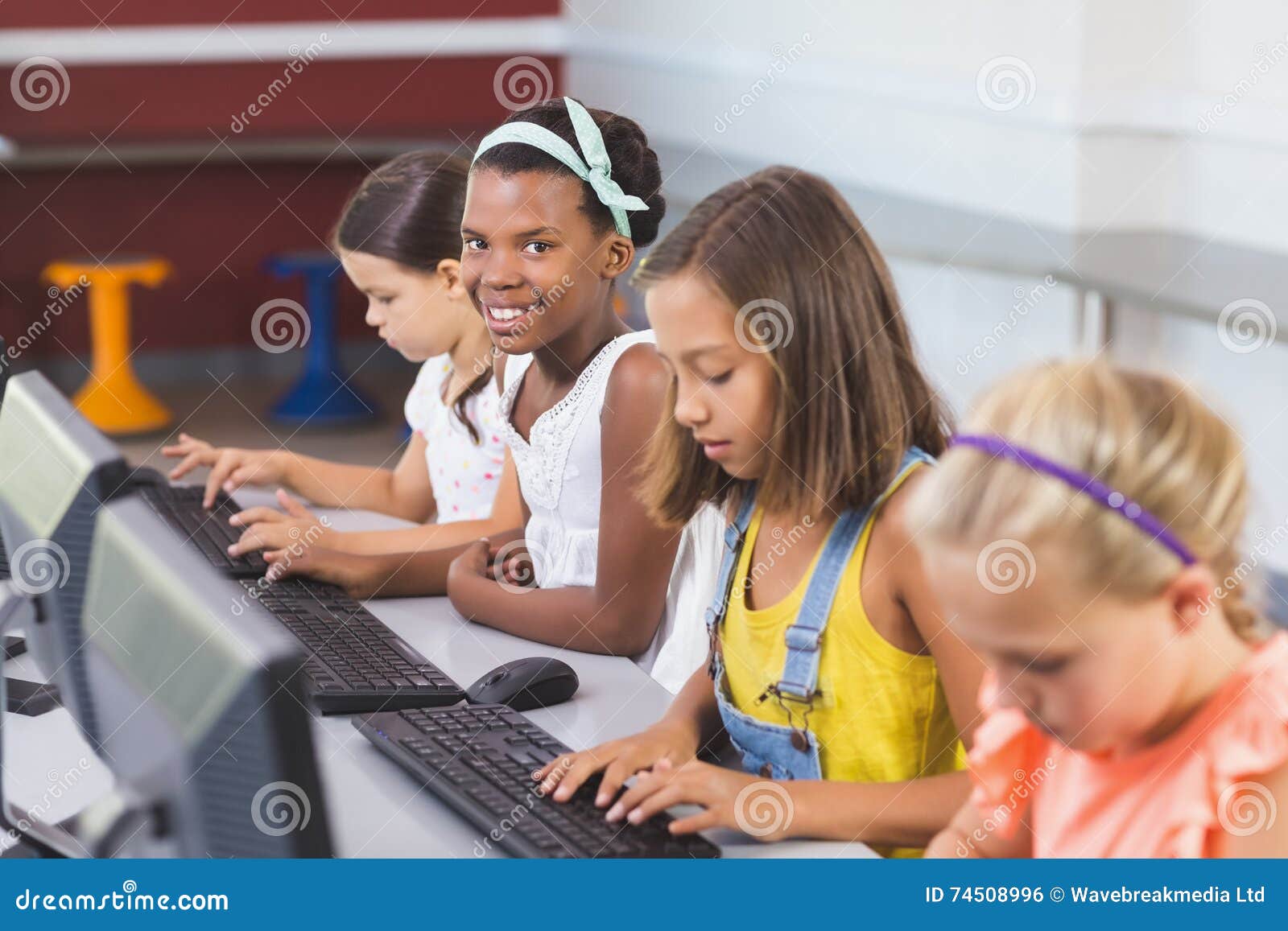 Schoolgirls Using Computer in Classroom Stock Photo - Image of ...