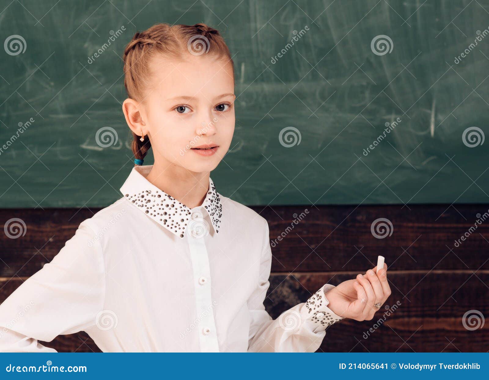 Schoolkid is Doing His Math Homework in Classroom at School. Pupil ...
