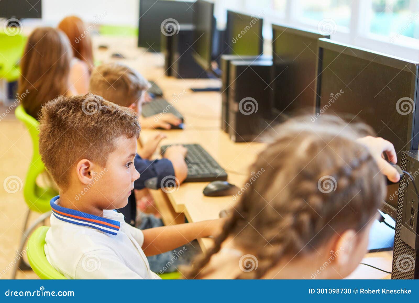 Schoolkid Sitting with Friends in Computer Class Stock Photo - Image of ...