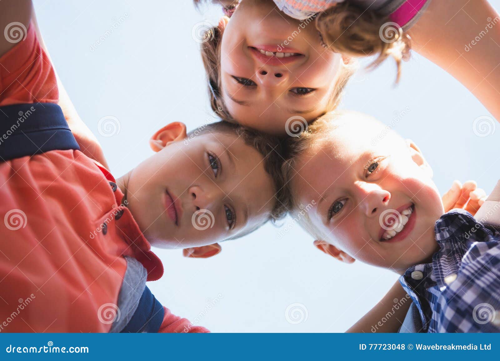Schoolkids Forming Huddle in Campus Stock Photo - Image of childhood ...