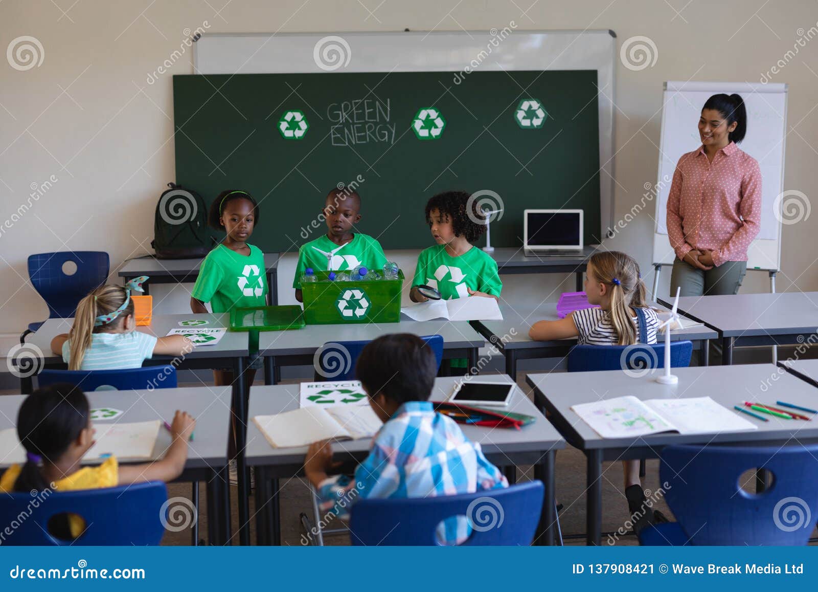 Schoolkids Studying about Green Energy and Recycle at Desk in Classroom ...