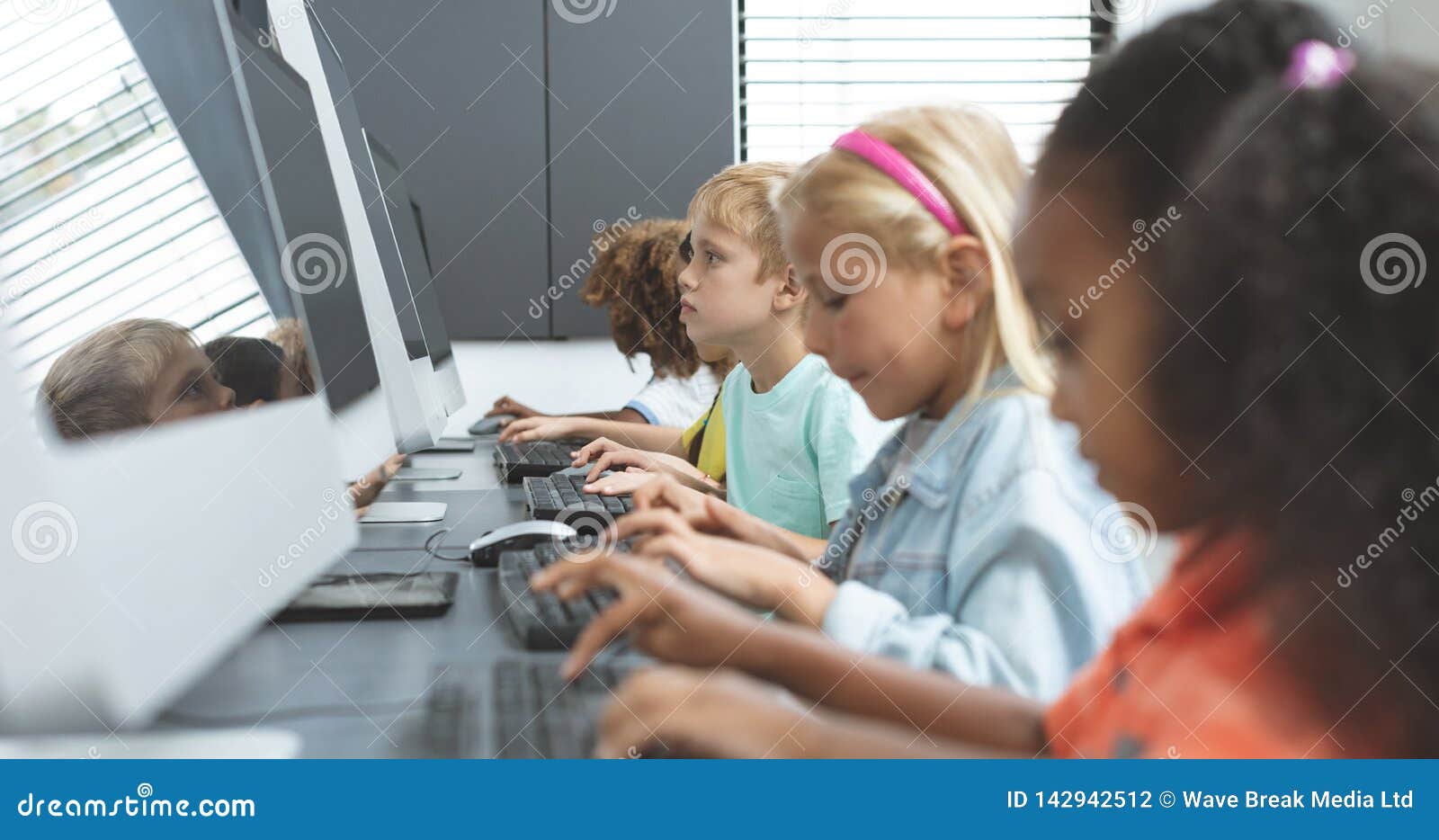 Schoolkids Using Computer at School Stock Photo - Image of computer ...