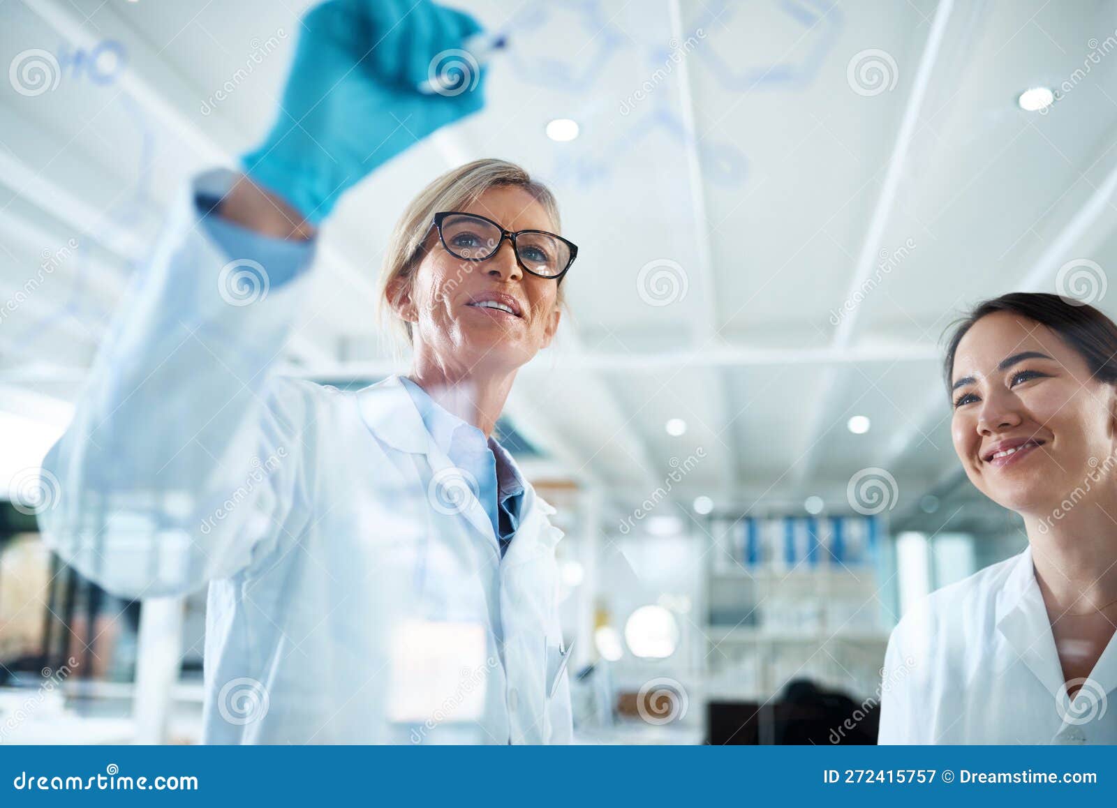 Science Can Be Exciting Too. Two Scientists Drawing Molecular ...