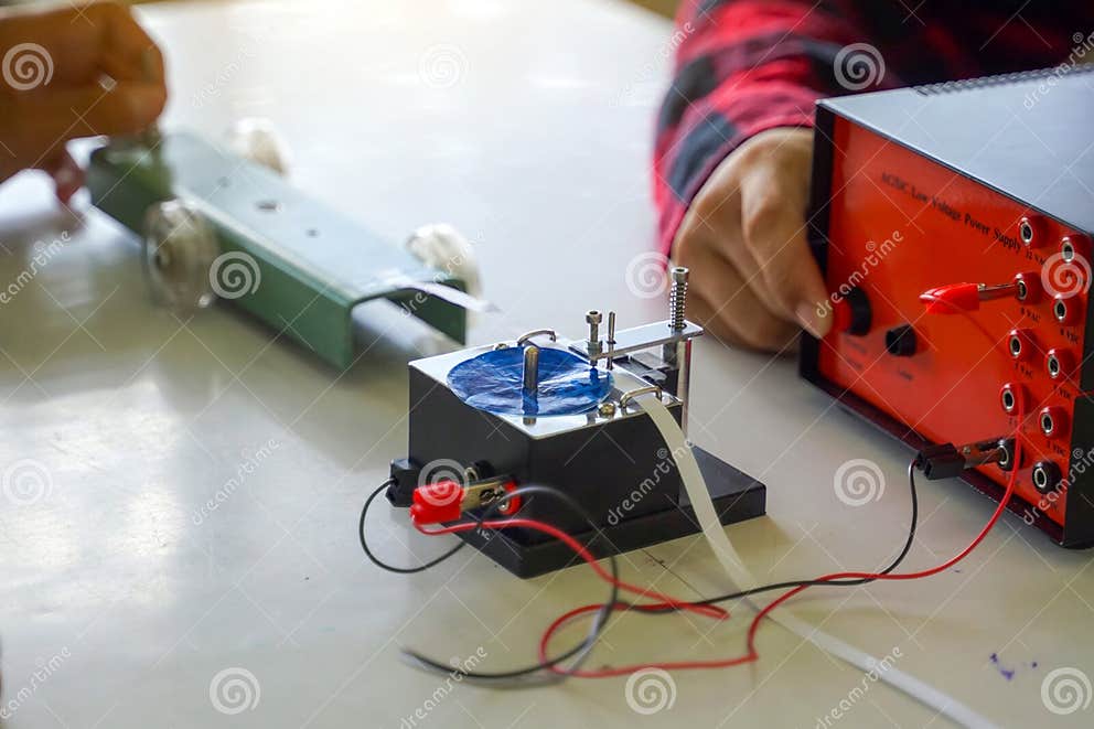 Science Classroom, Students are Conducting a Physics Experiment on the ...