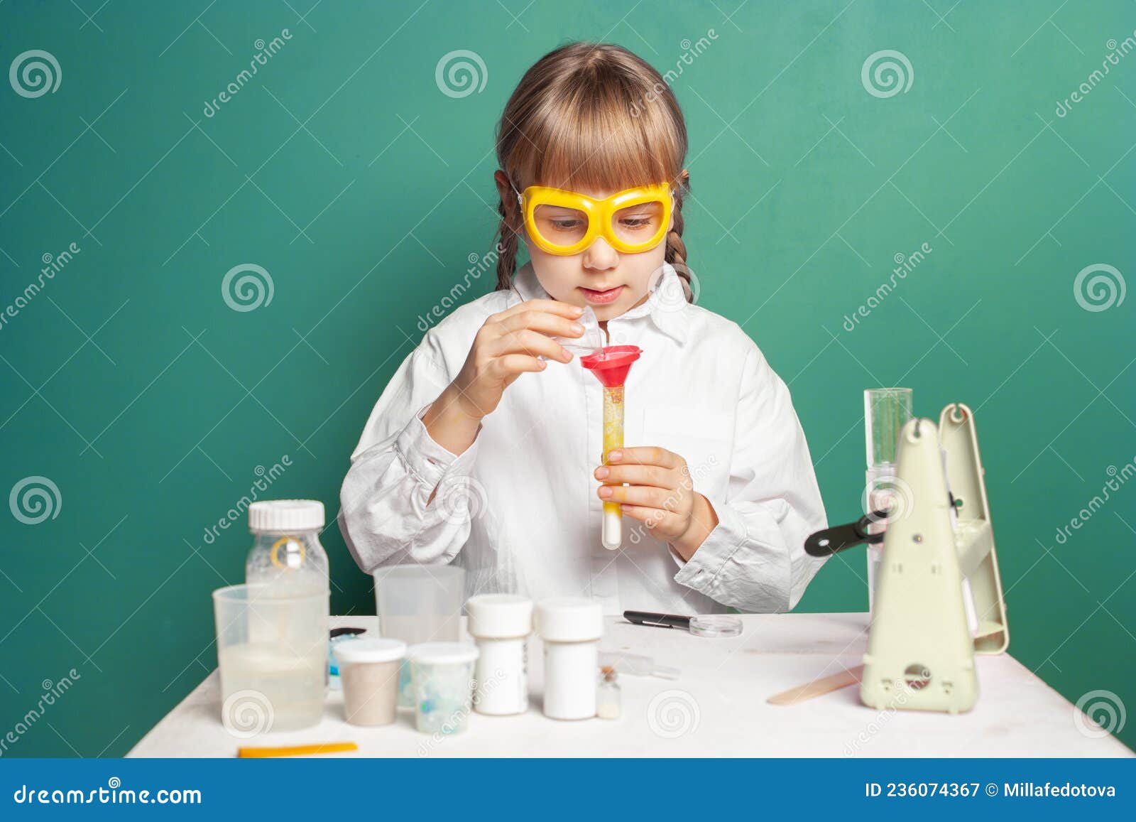 Science and Education Concept. Cute Little Girl Doing Experiments in ...