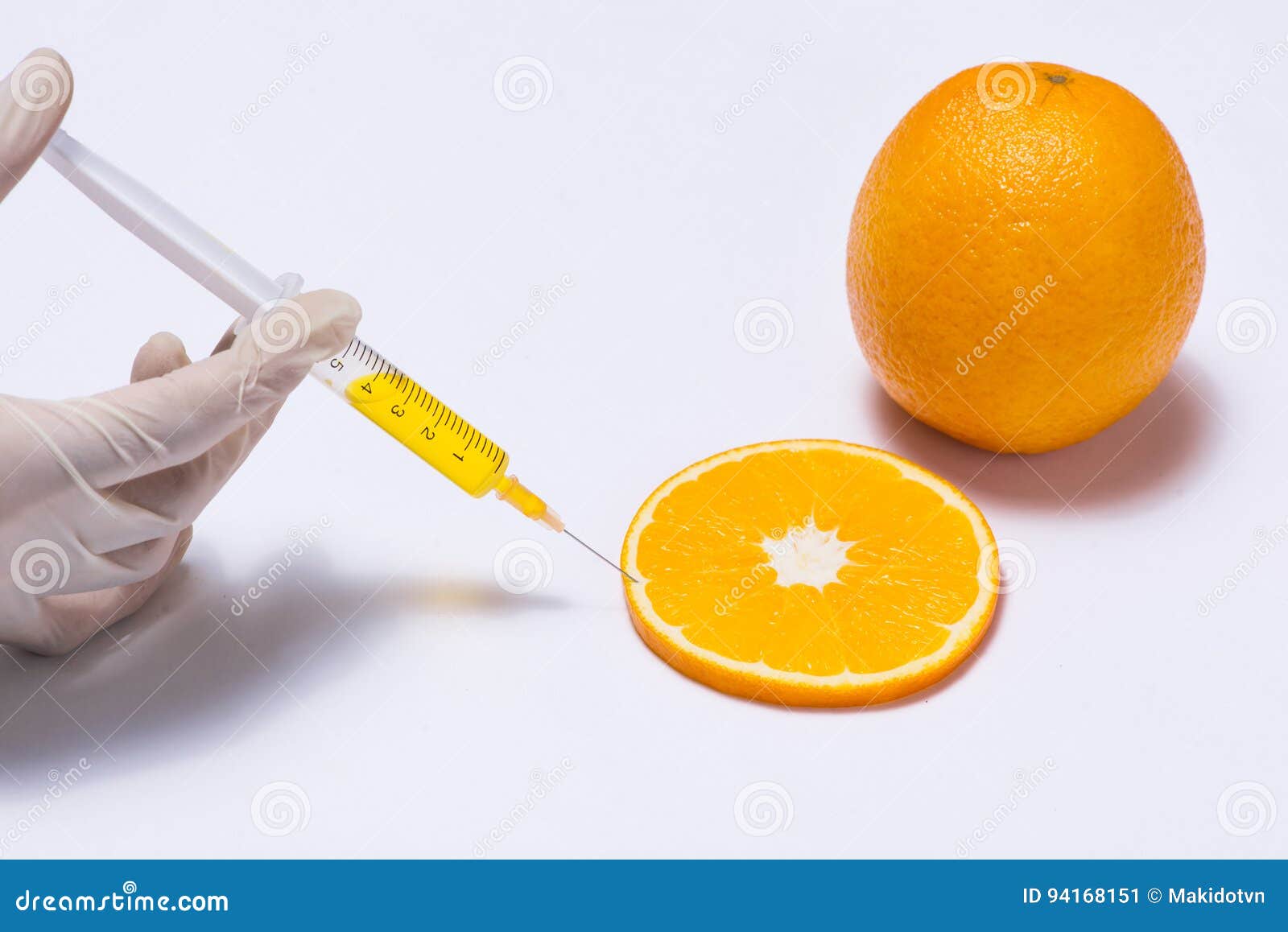 Science Experiment with Orange and Syringe Isolated on White. Stock ...