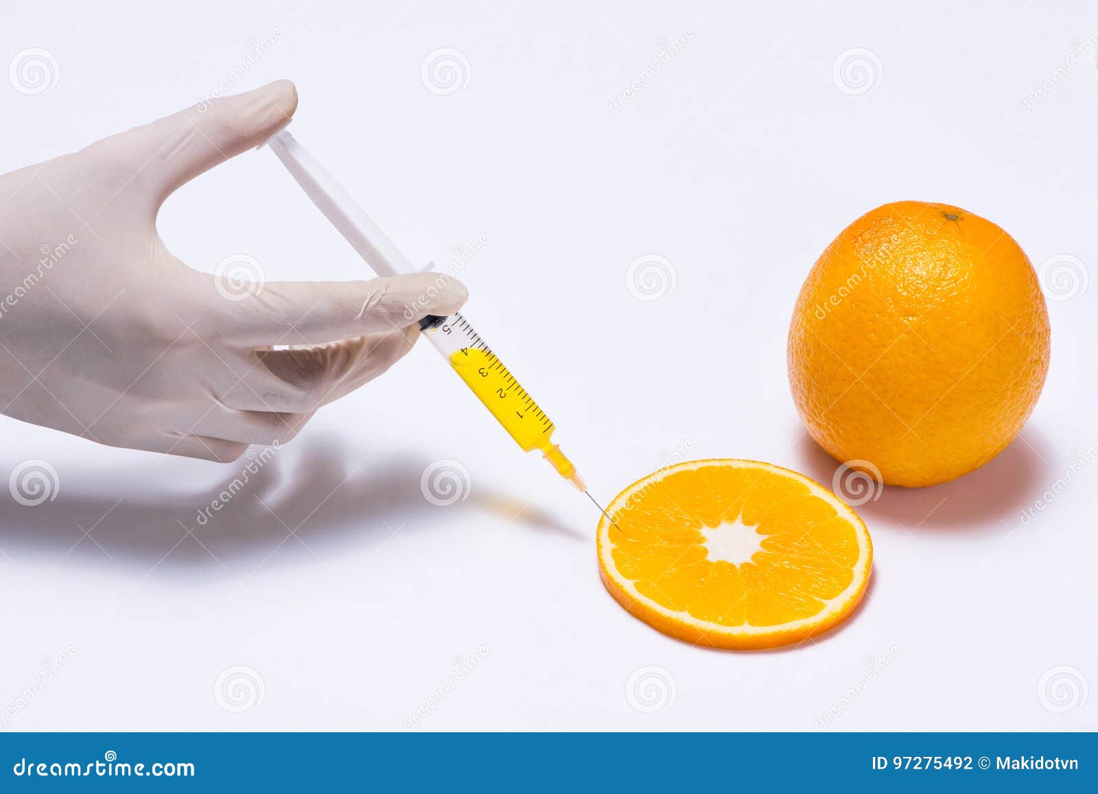 Science Experiment with Orange and Syringe on White. Stock Photo ...
