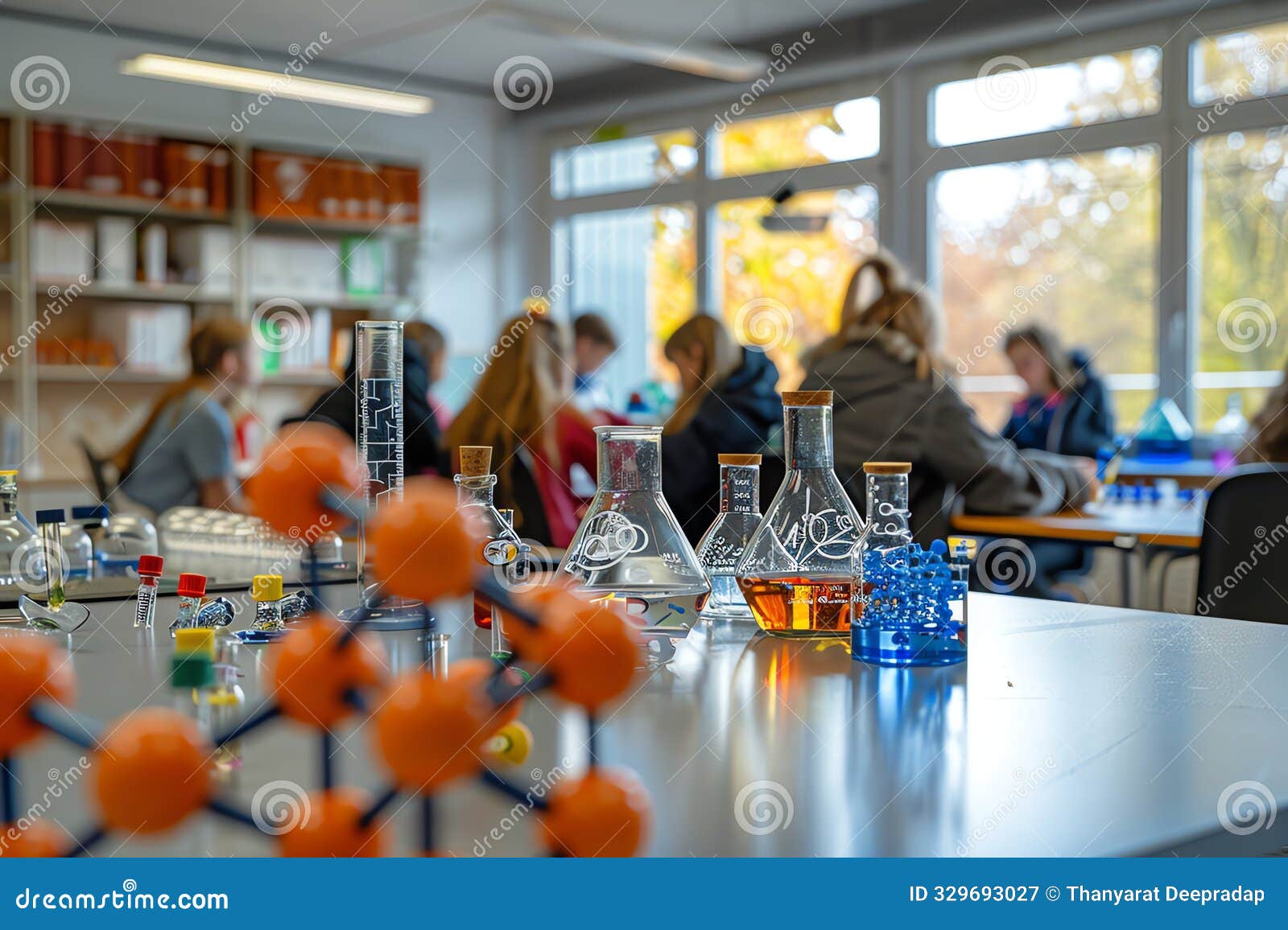 Science Lab with Students Learning in the Background, Flasks and ...