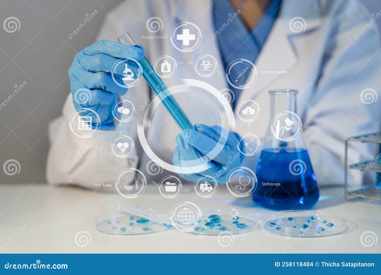 Science and Medicine, Scientist Analyzing and Dropping a Sample into a ...