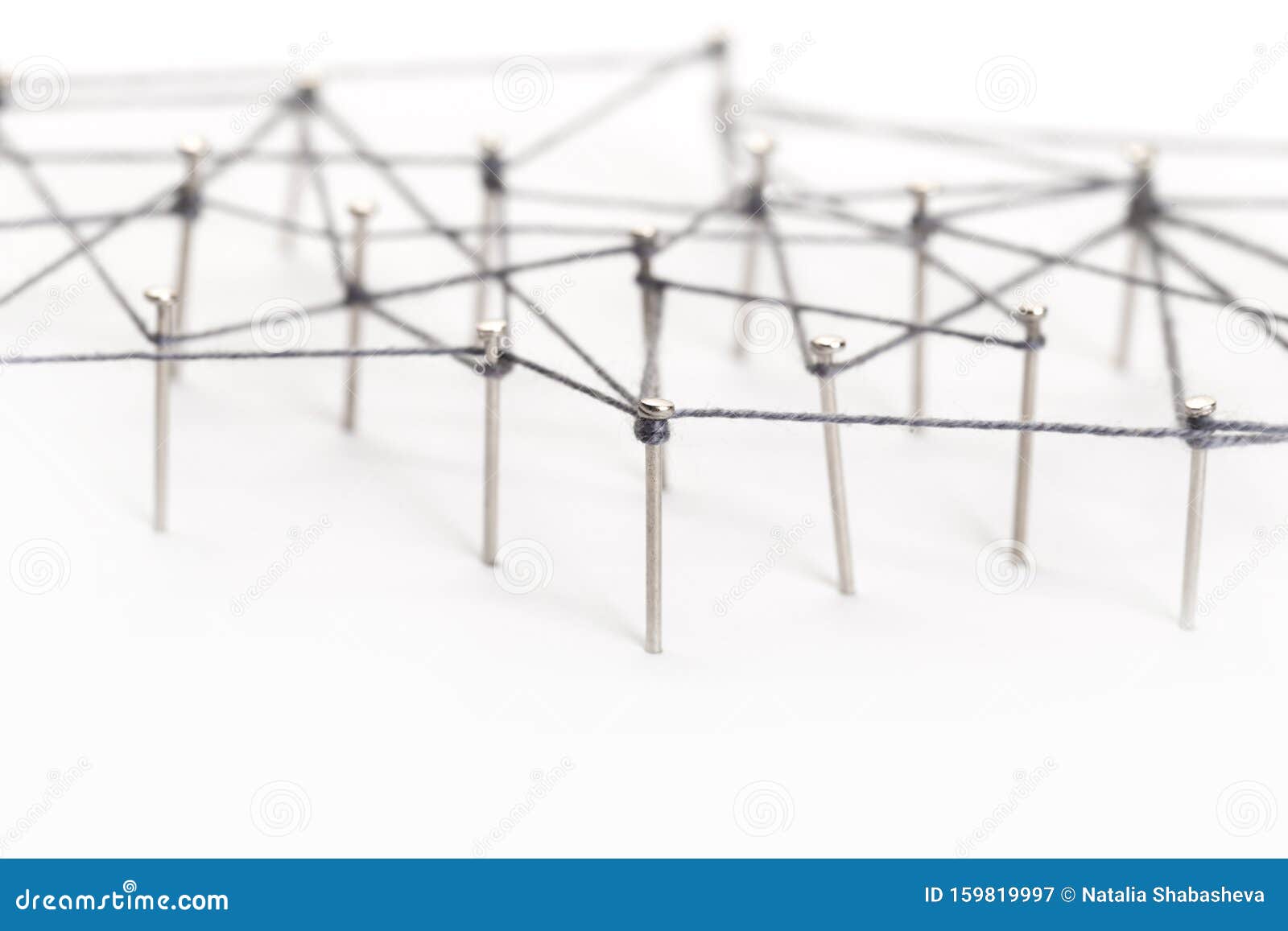 A Large Grid of Pins Connected with String. Communication, NetwA Large ...