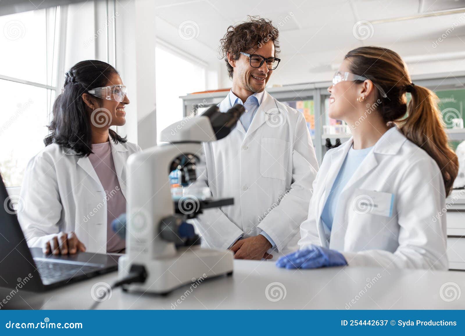 Scientists with Microscope Working in Laboratory Stock Image - Image of ...