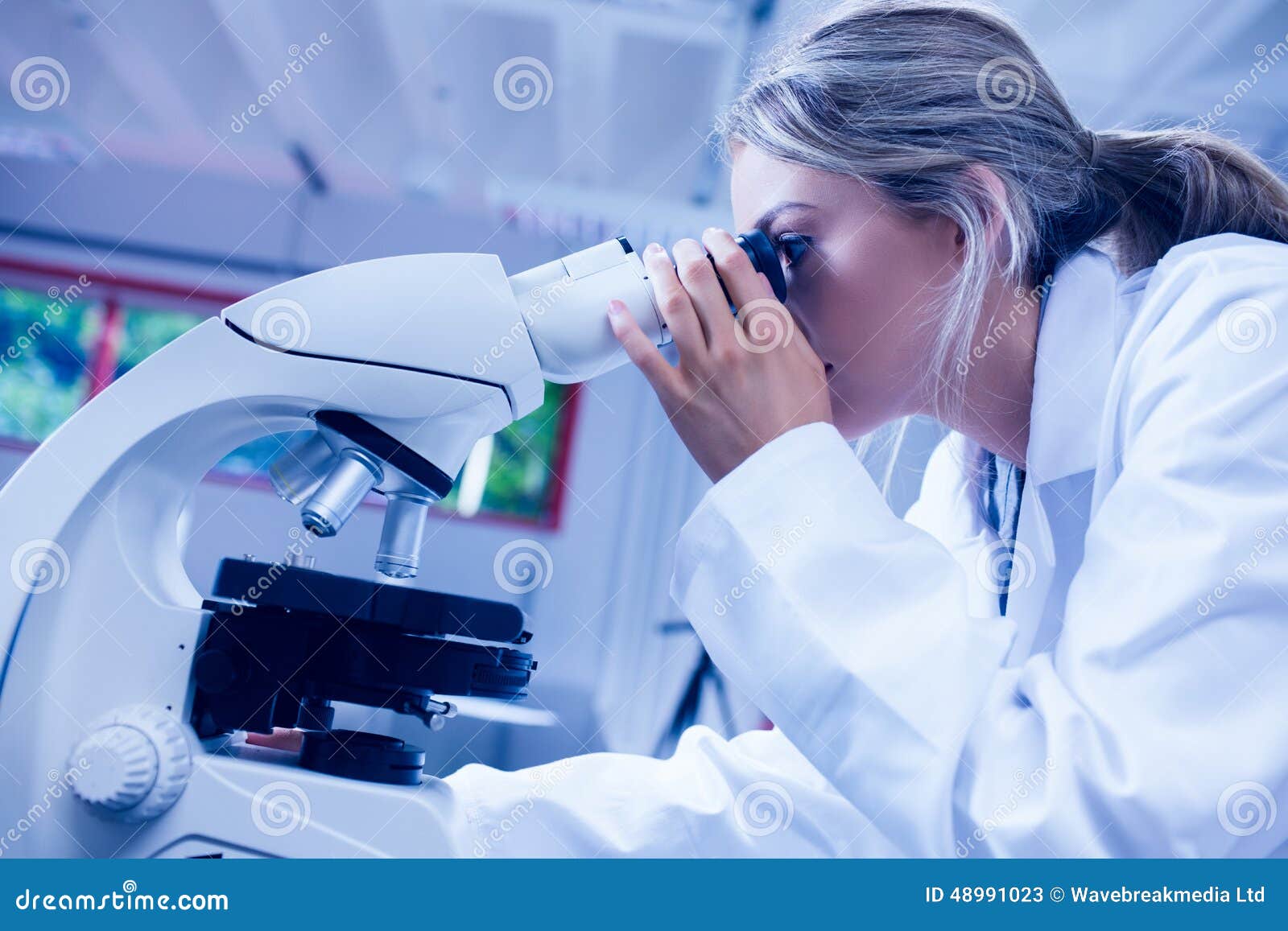 Science Student Looking through Microscope in the Lab Stock Image ...