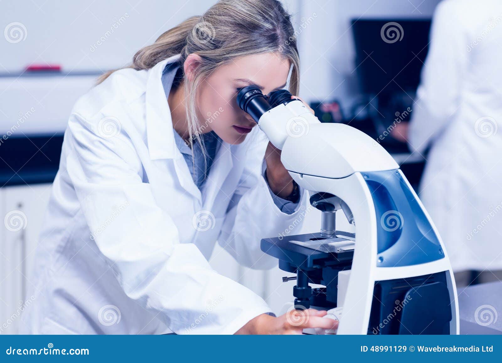Science Student Looking through Microscope in the Lab Stock Image ...