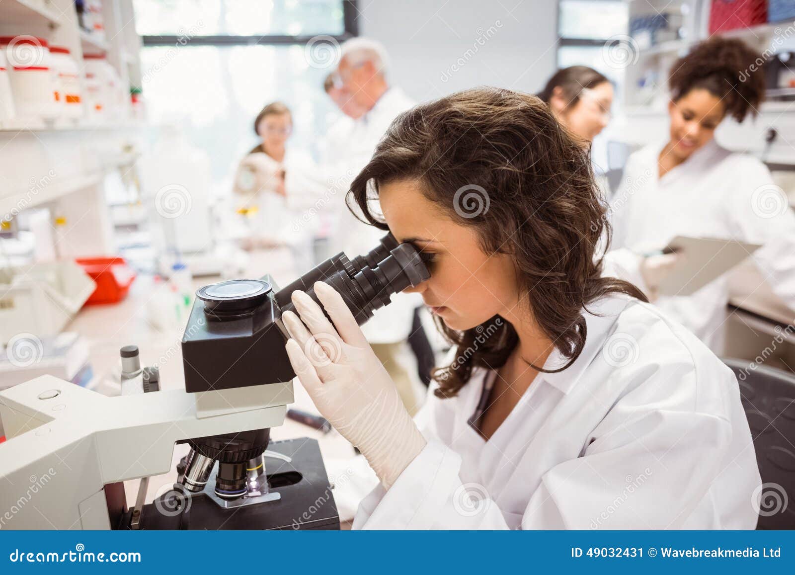 Science Student Looking through Microscope in the Lab Stock Image ...