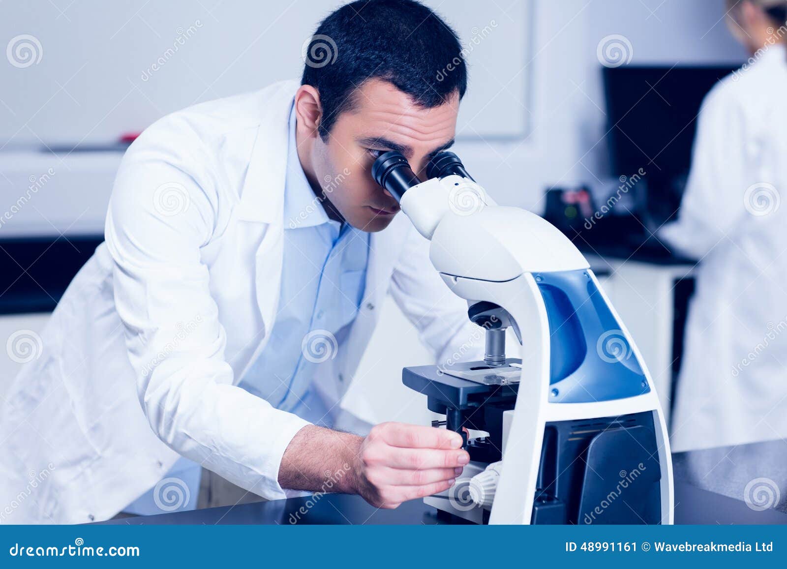 Science Student Looking through Microscope Stock Image - Image of ...