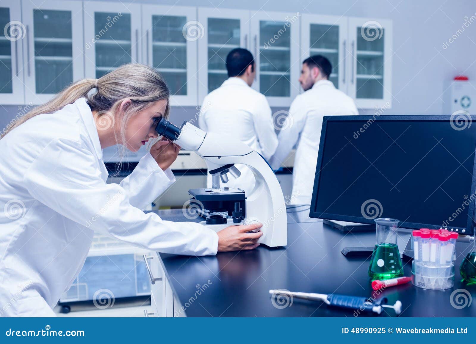Science Student Working with Microscope in the Lab Stock Image - Image ...