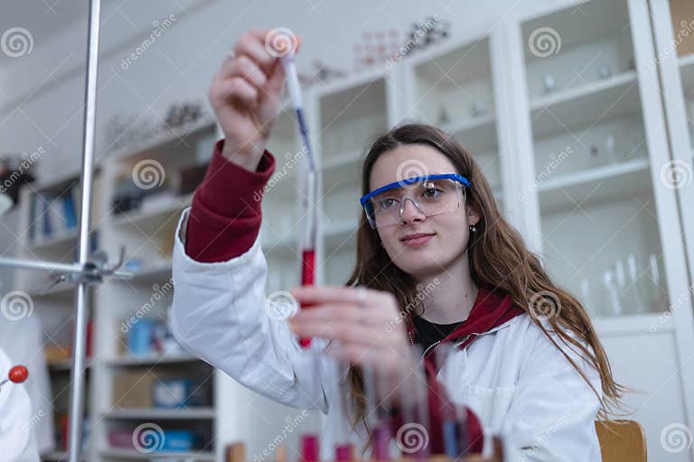 Science Students Doing Chemical Experiment in the Laboratory at ...