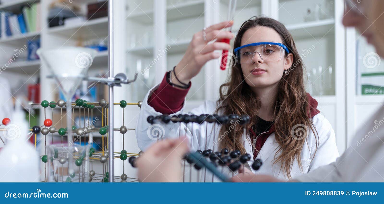 Science Students Doing Chemical Experiment in the Laboratory at ...
