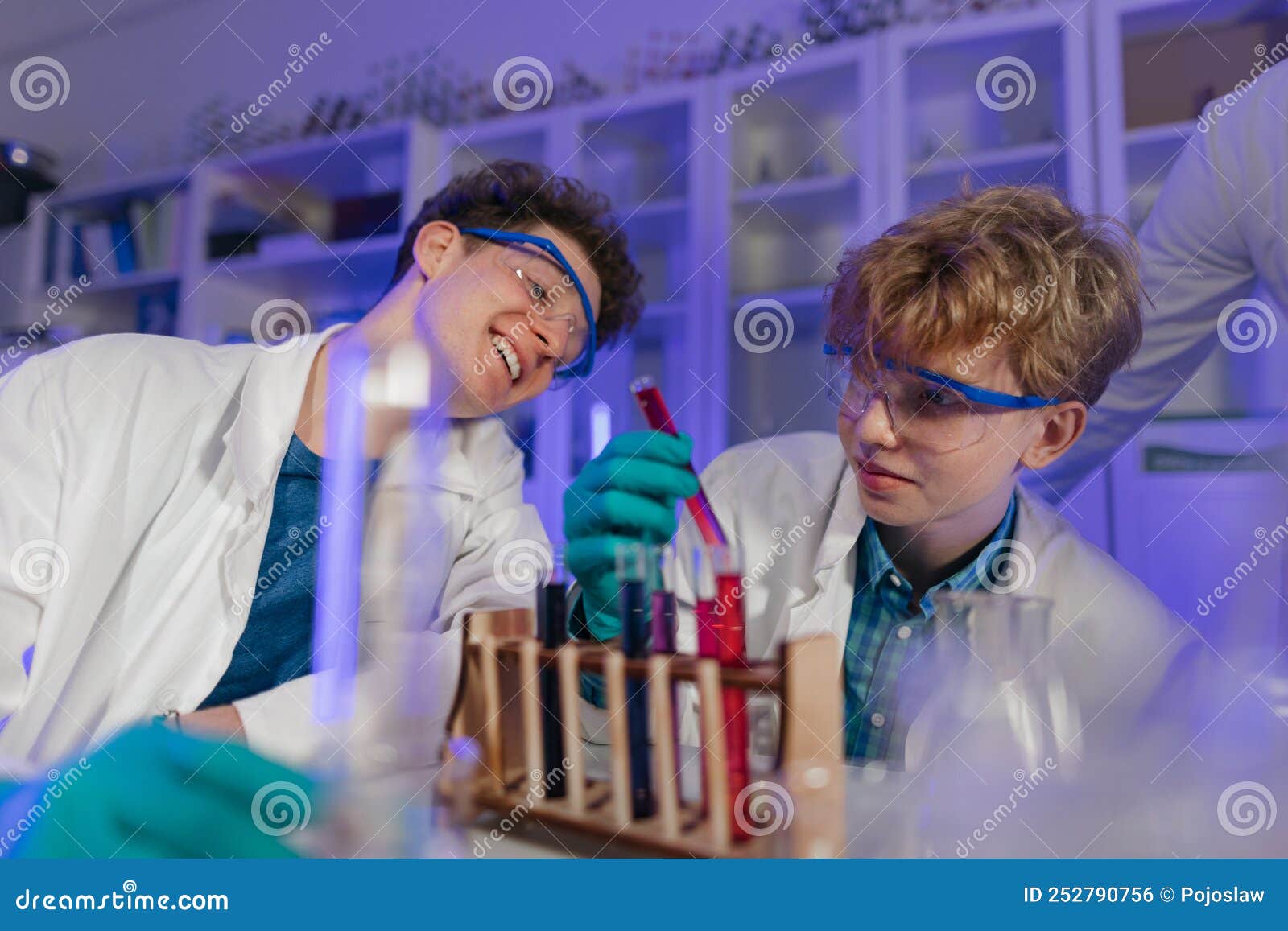 Science Students Doing Chemical Experiment in the Laboratory at ...