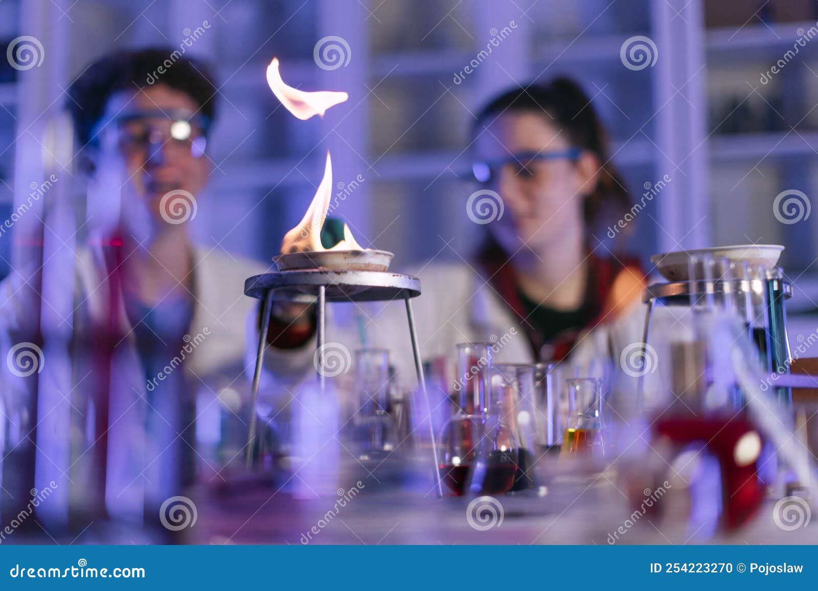 Science Students Doing Chemical Experiment in the Laboratory at ...