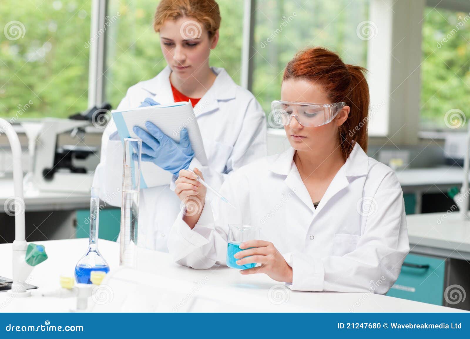Science Students Doing an Experiment Stock Photo - Image of clipboard ...