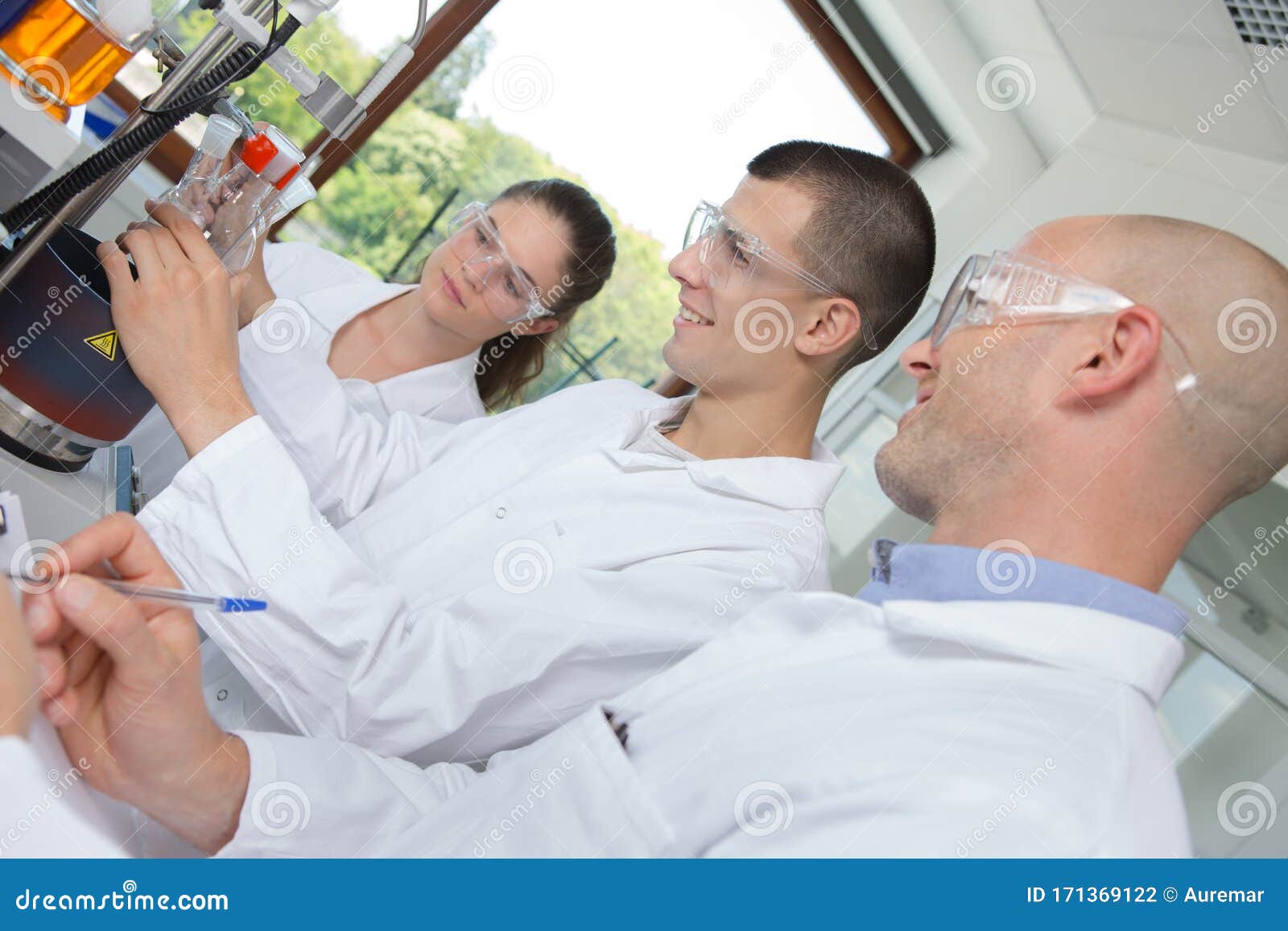Science Students Performing Experiment Stock Photo - Image of research ...