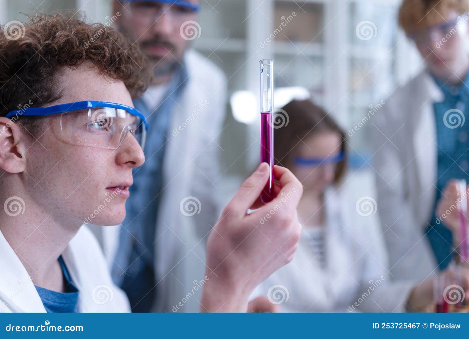 Science Students with Teacher Doing Chemical Experiment in the ...