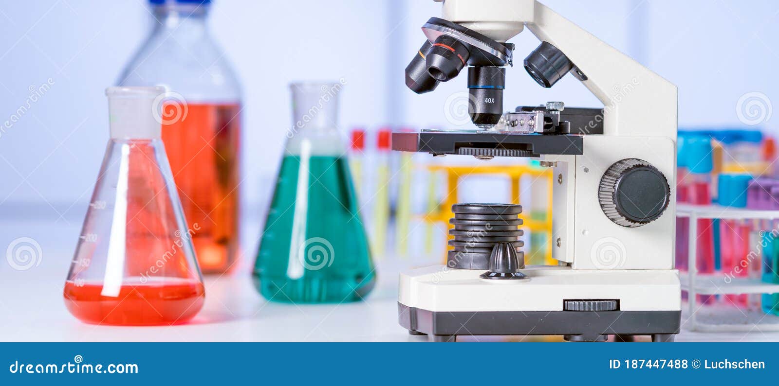 Scientific Experiment in School Class. Microscope and Test Tubes on the ...