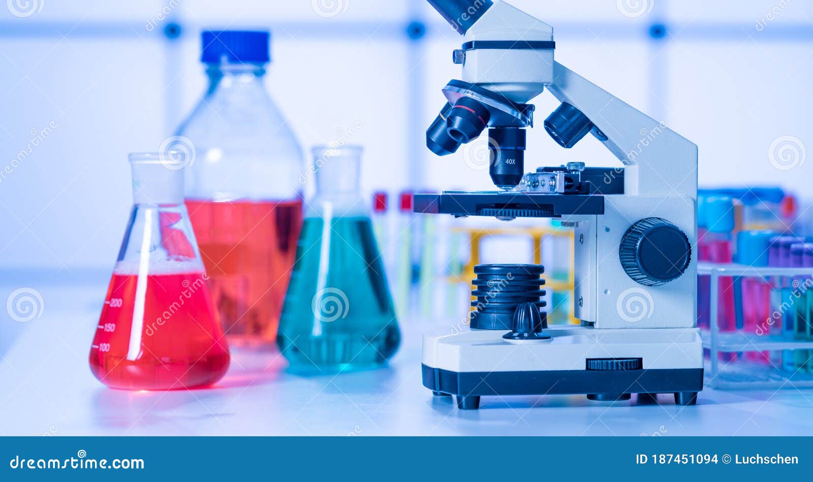 Scientific Experiment in School Class. Microscope and Test Tubes on the ...