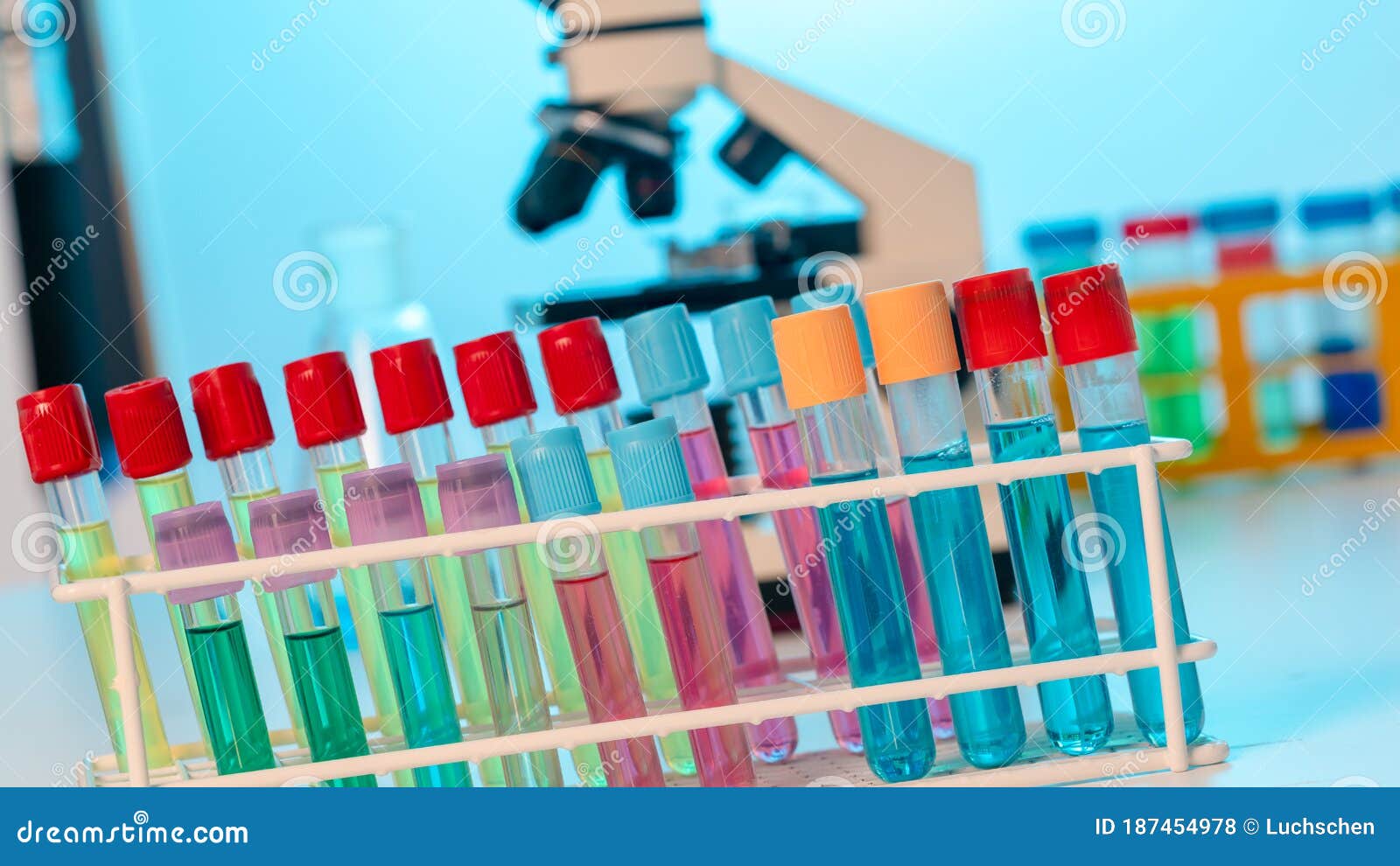 Scientific Experiment in School Class. Microscope and Test Tubes on the ...