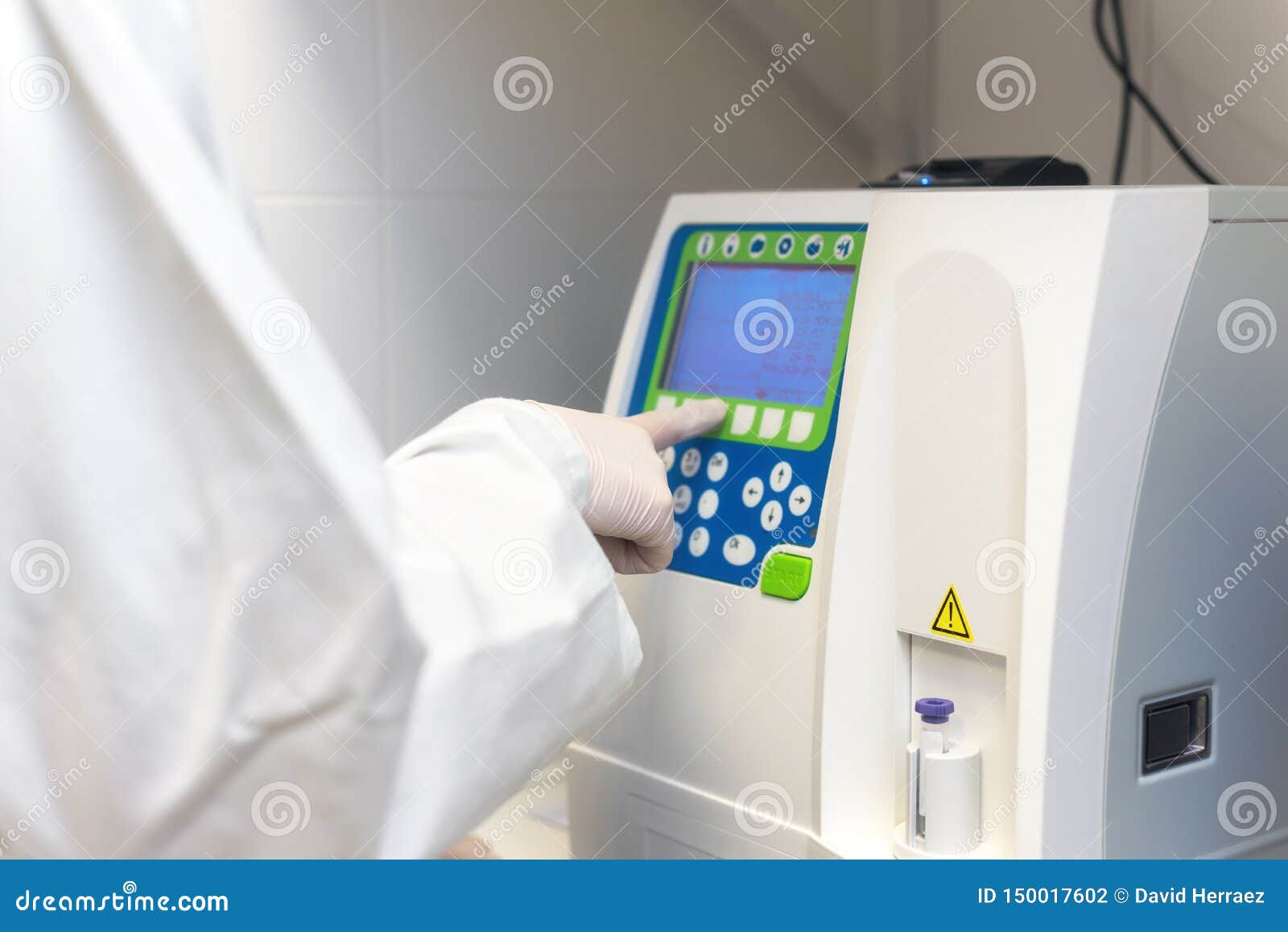 Hematology Test. Doctor In Lab Examining Blood Sample In Laptop Stock ...