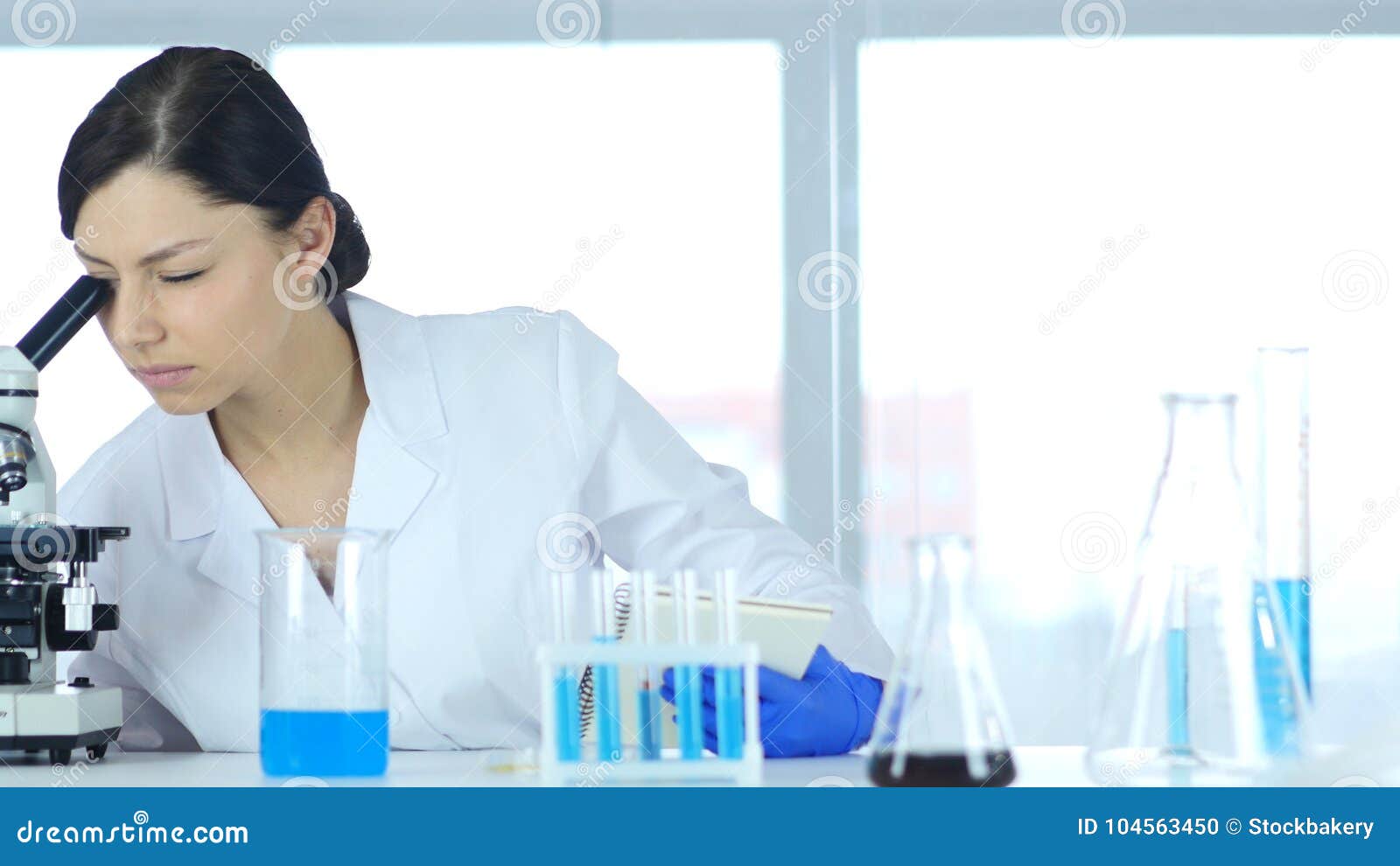 Scientific Reseacher Using Microscope in Laboratory for Experiment ...
