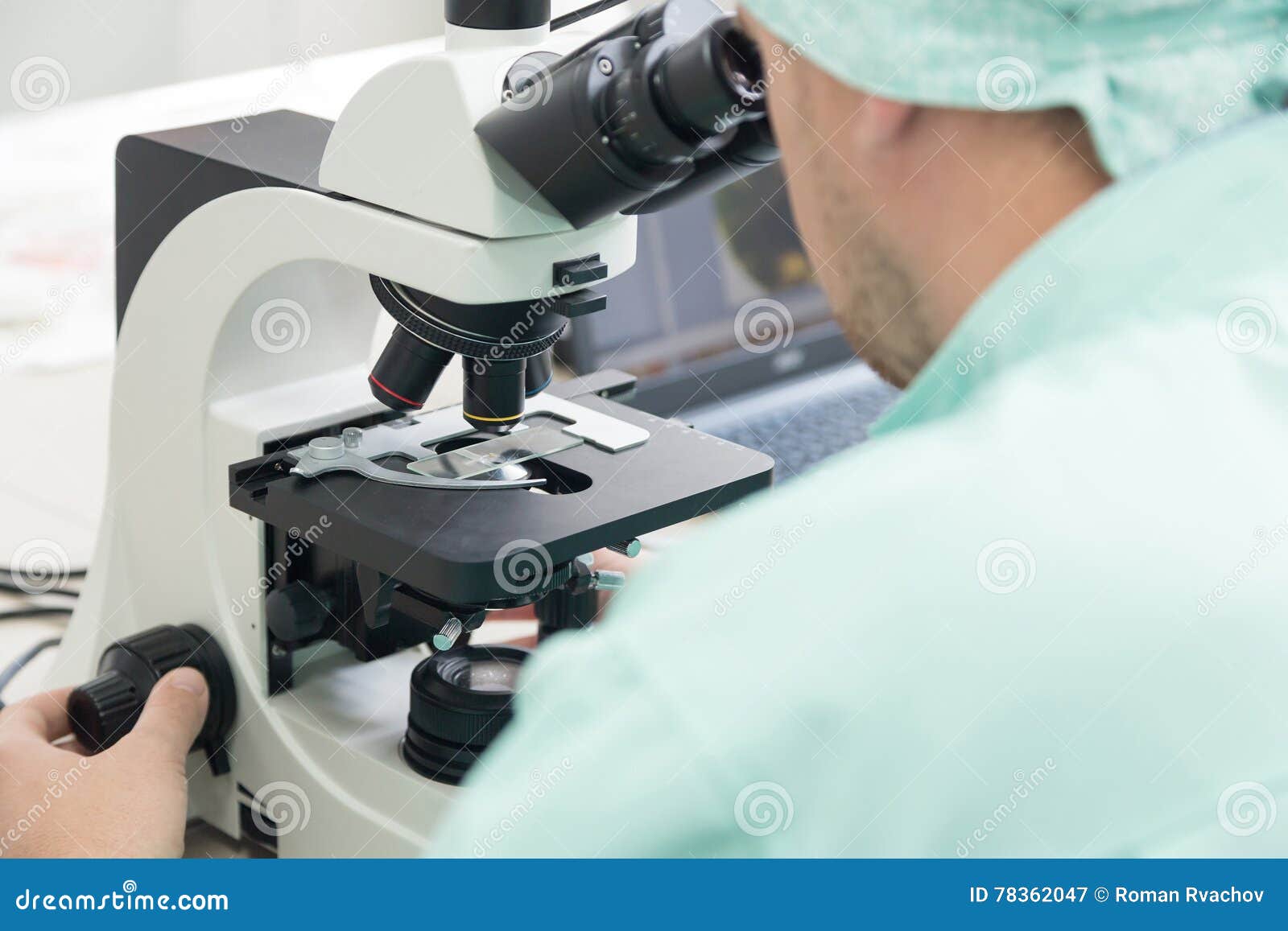 Scientific Researcher in the Laboratory with a Microscope Stock Image ...