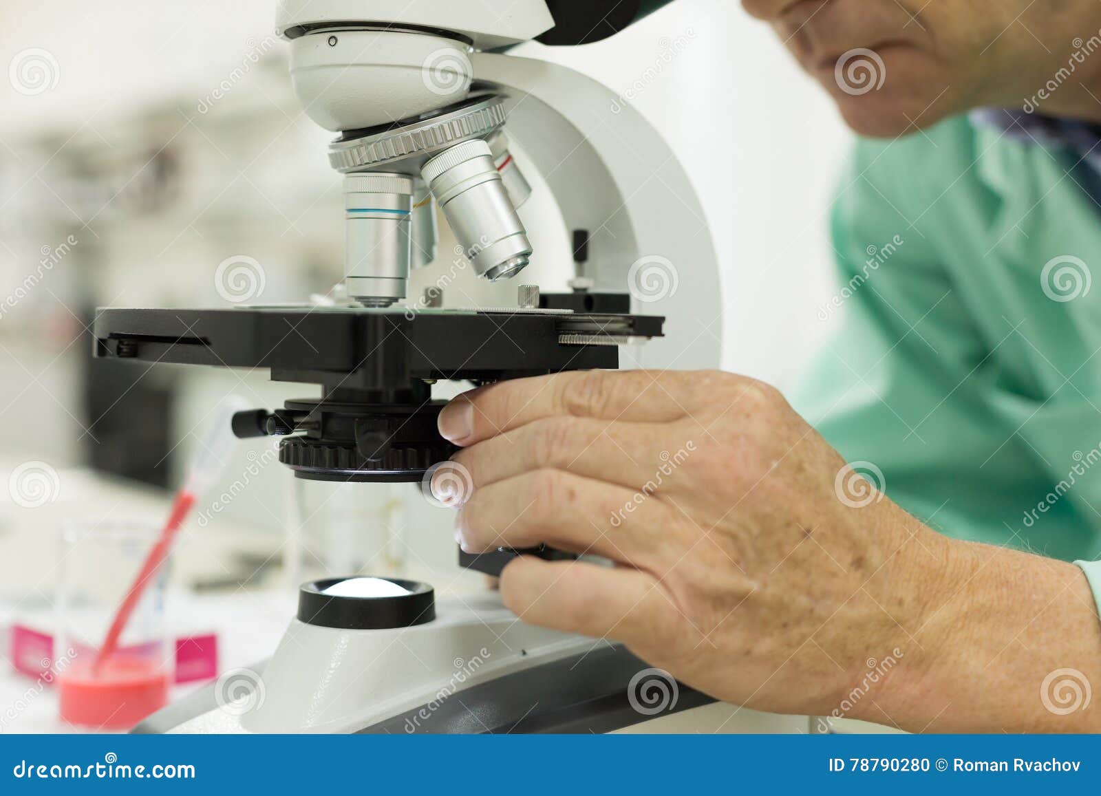 Scientific Researcher in the Laboratory with a Microscope Stock Photo ...