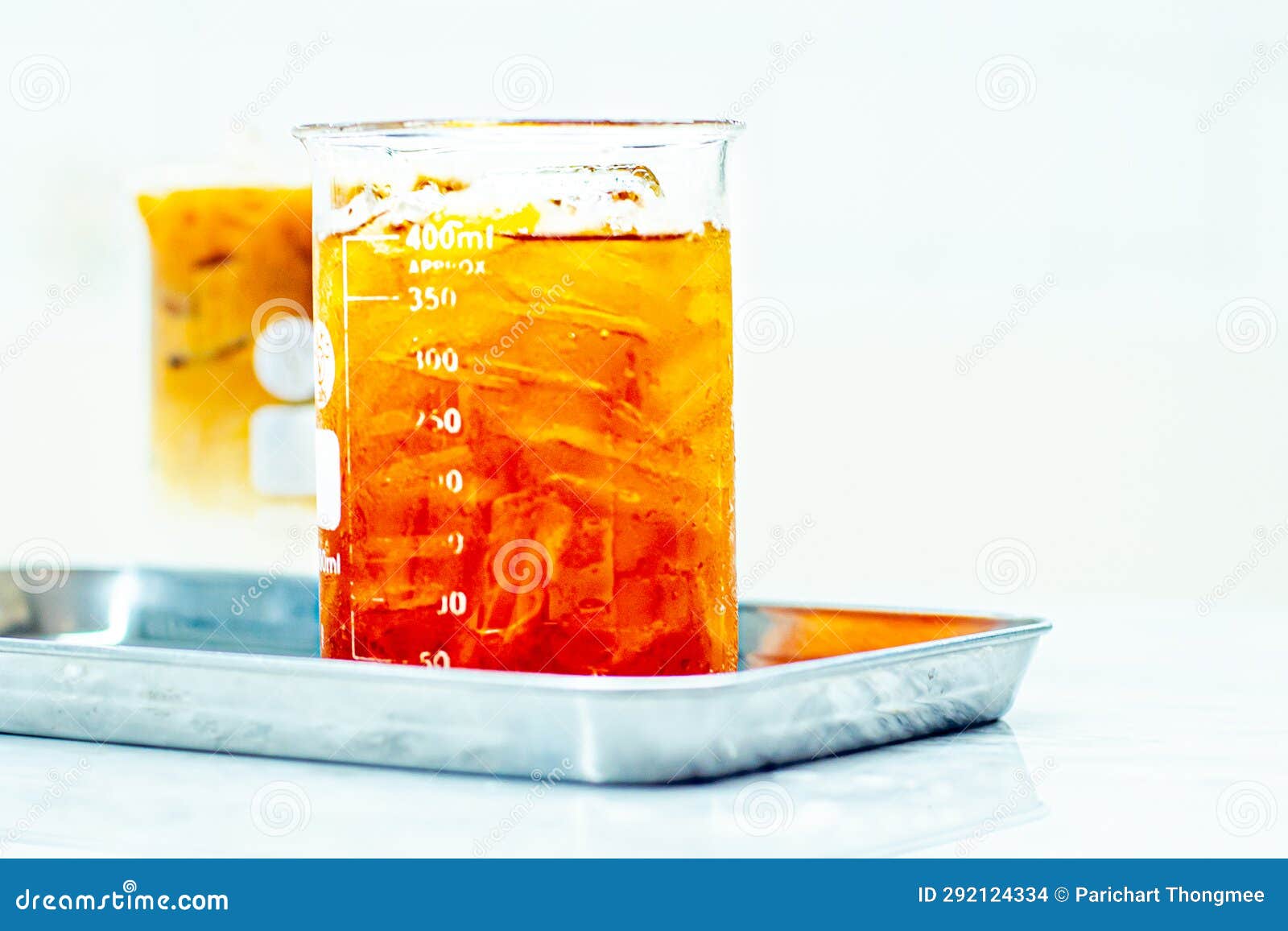 Scientific Sips: Enjoying an Ice Beverage in a Lab Beaker Stock Photo ...