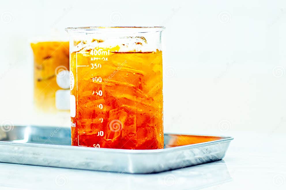 Scientific Sips: Enjoying an Ice Beverage in a Lab Beaker Stock Photo ...
