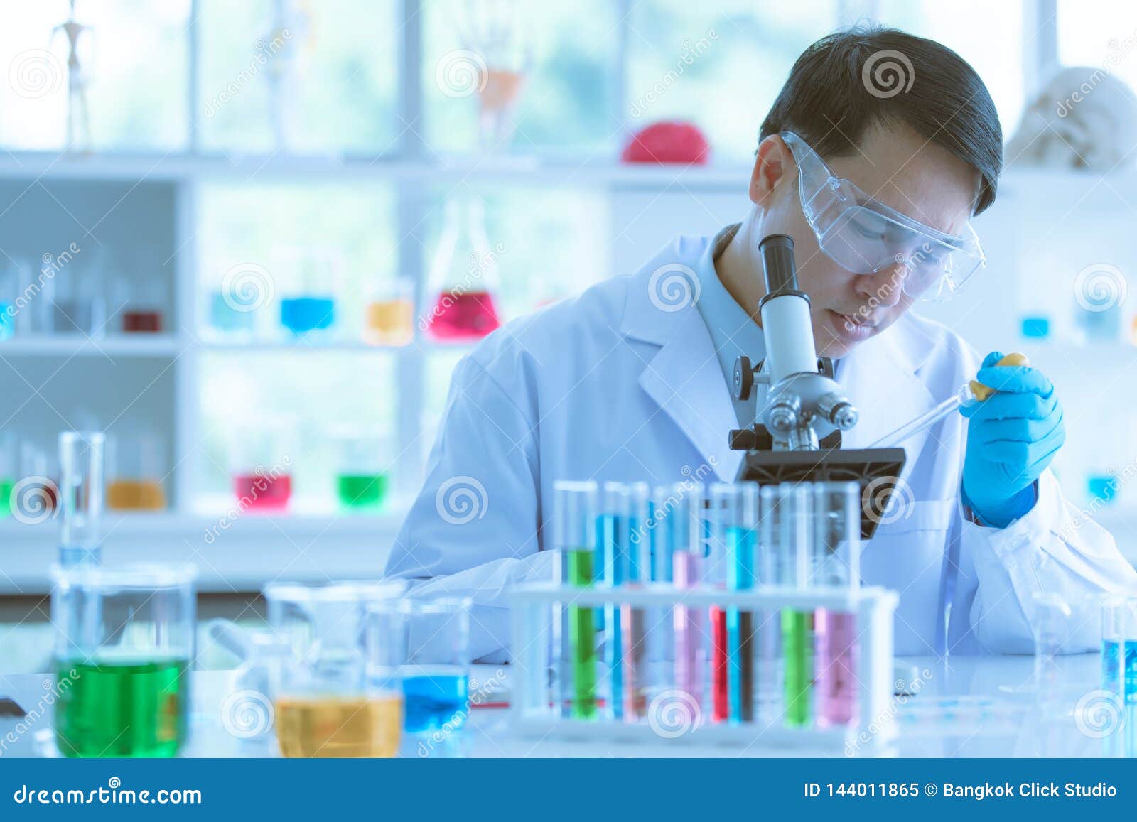 Scientist Adjusting Microscope for Experiment Stock Image - Image of ...