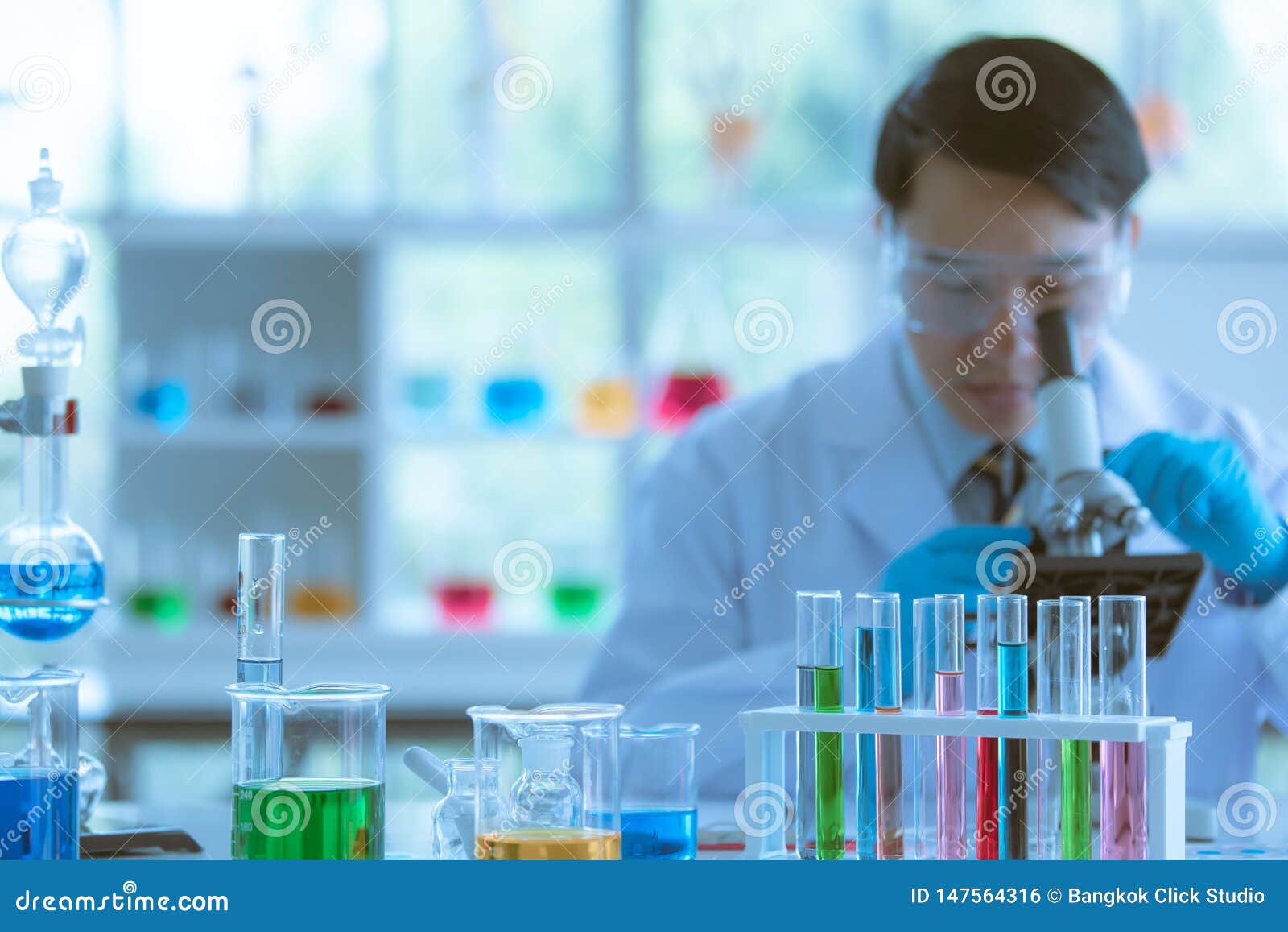 Scientist Adjusting Microscope for Experiment Stock Photo - Image of ...