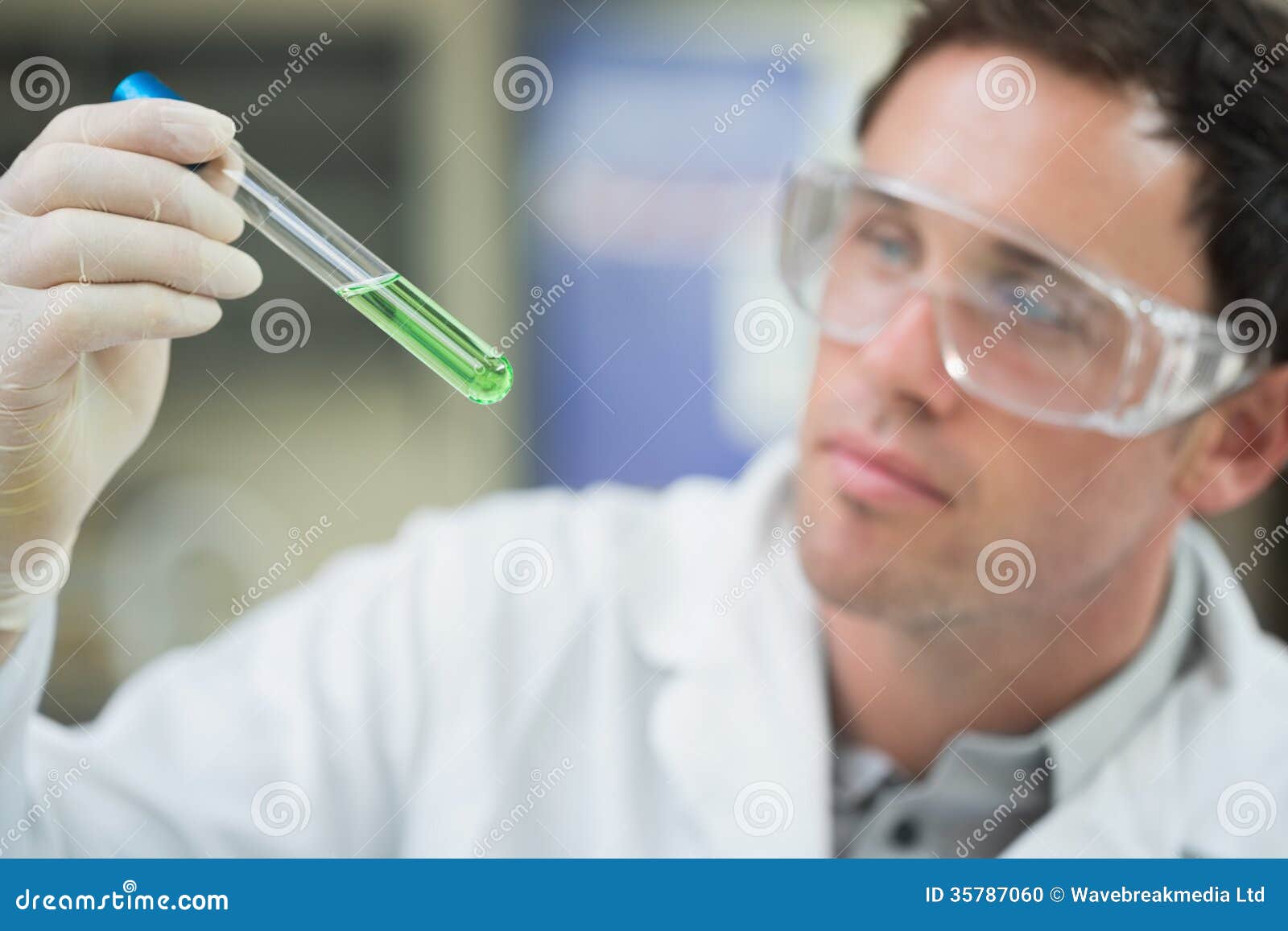 Scientist Analyzing Green Solution in Test Tube at Laboratory Stock ...