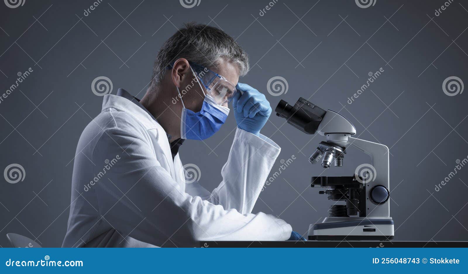 Scientist Analyzing Samples Under the Microscope Stock Image - Image of ...