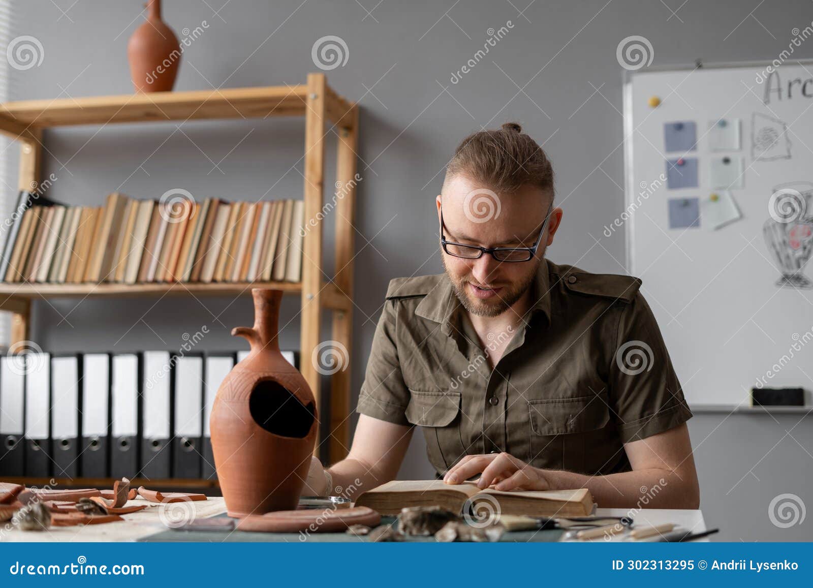 Scientist Archaeologist Working in Office Reading Book Studying Ancient ...