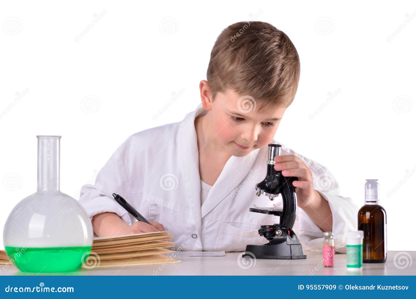 Scientist Boy at the Desk in the Lab Write Research Results Stock Image ...