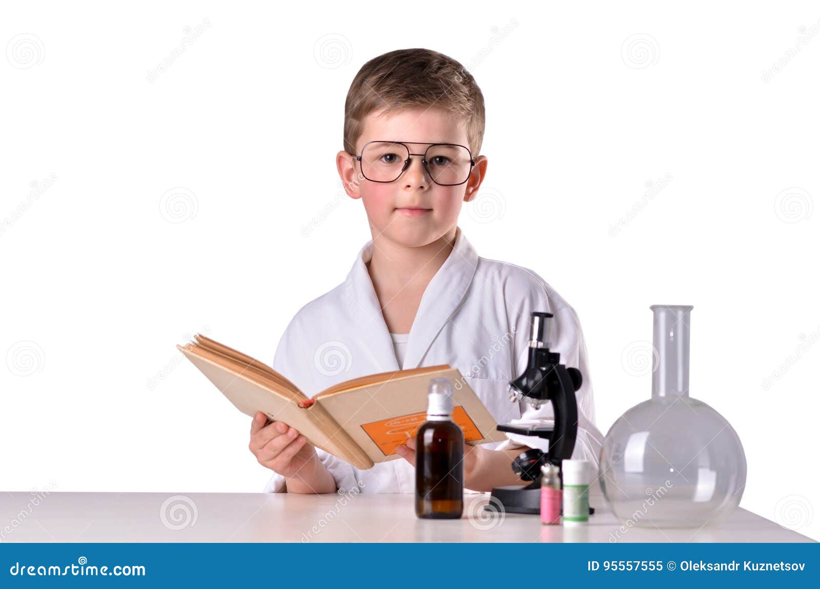 Scientist Boy with Open Book at the Desk in Lab Stock Image - Image of ...