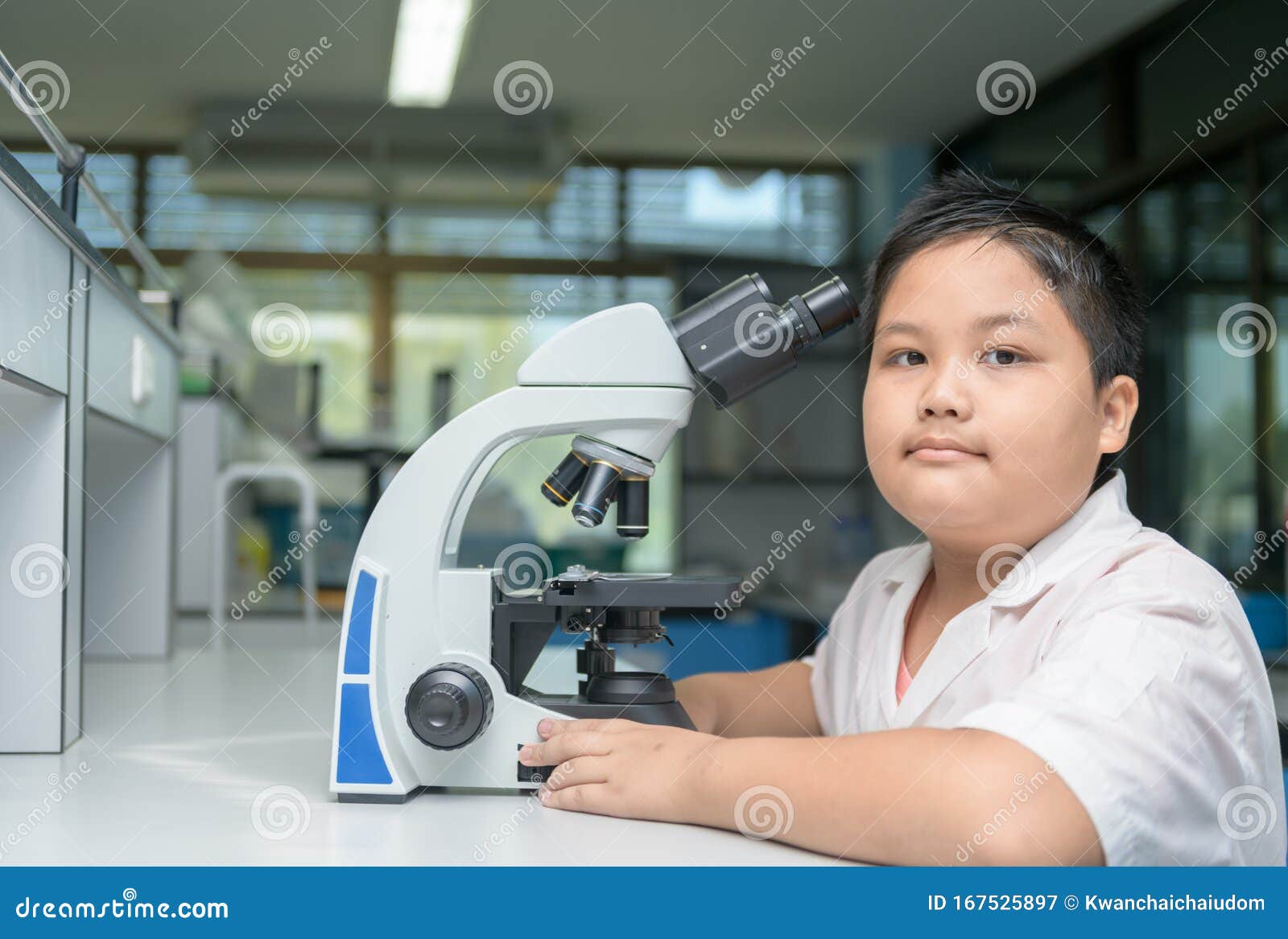 Scientist Boy Working with Microscope in Laboratory Stock Image - Image ...