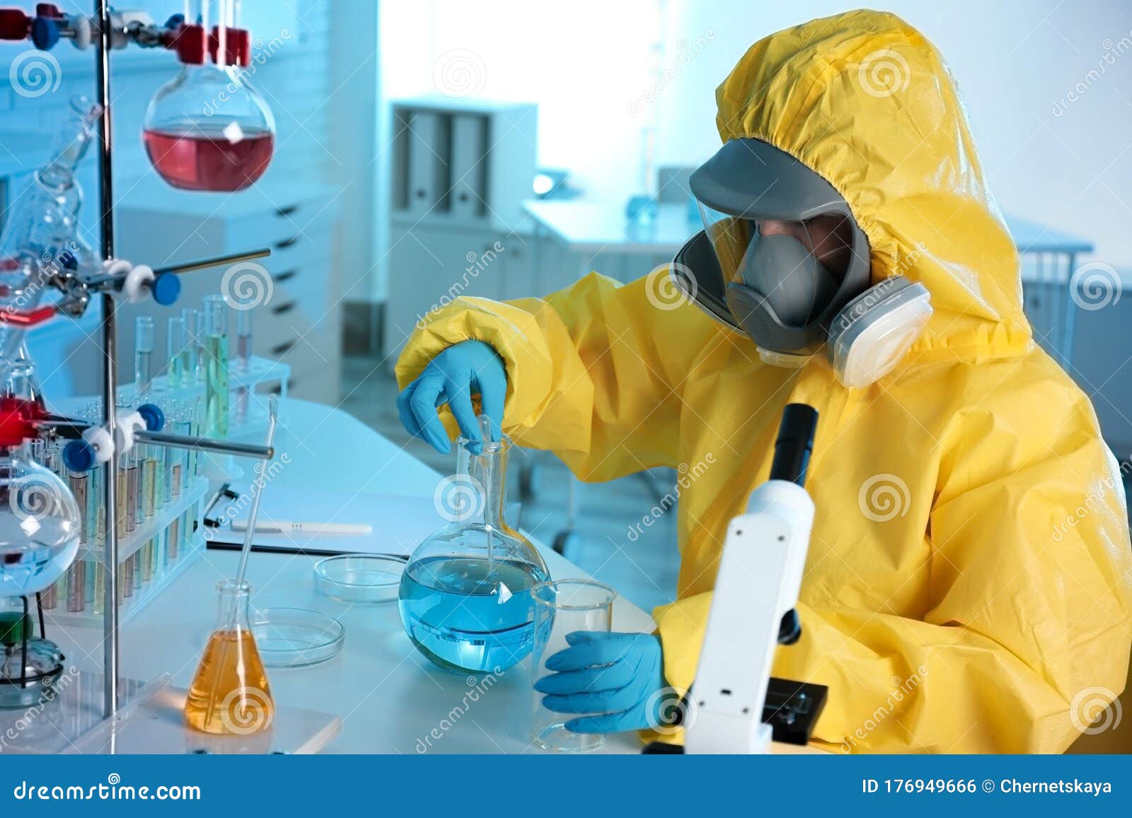 Scientist in Chemical Protective Suit Working. Virus Research Stock ...