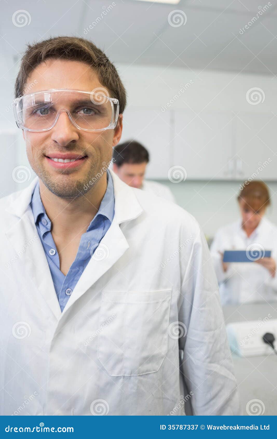 Scientist with Colleagues at Work in the Lab Stock Image - Image of ...