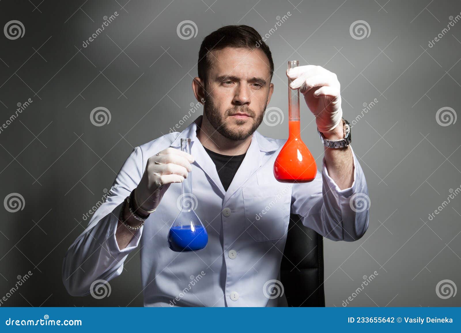 Male Doctor Biologist in a White Coat Compares Two Dangerous Biological ...